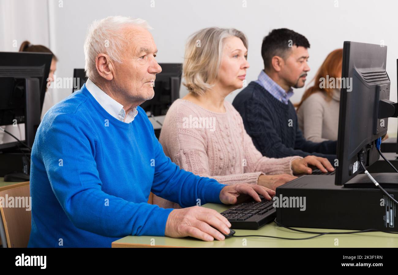 People of different age studying in computer class Stock Photo - Alamy