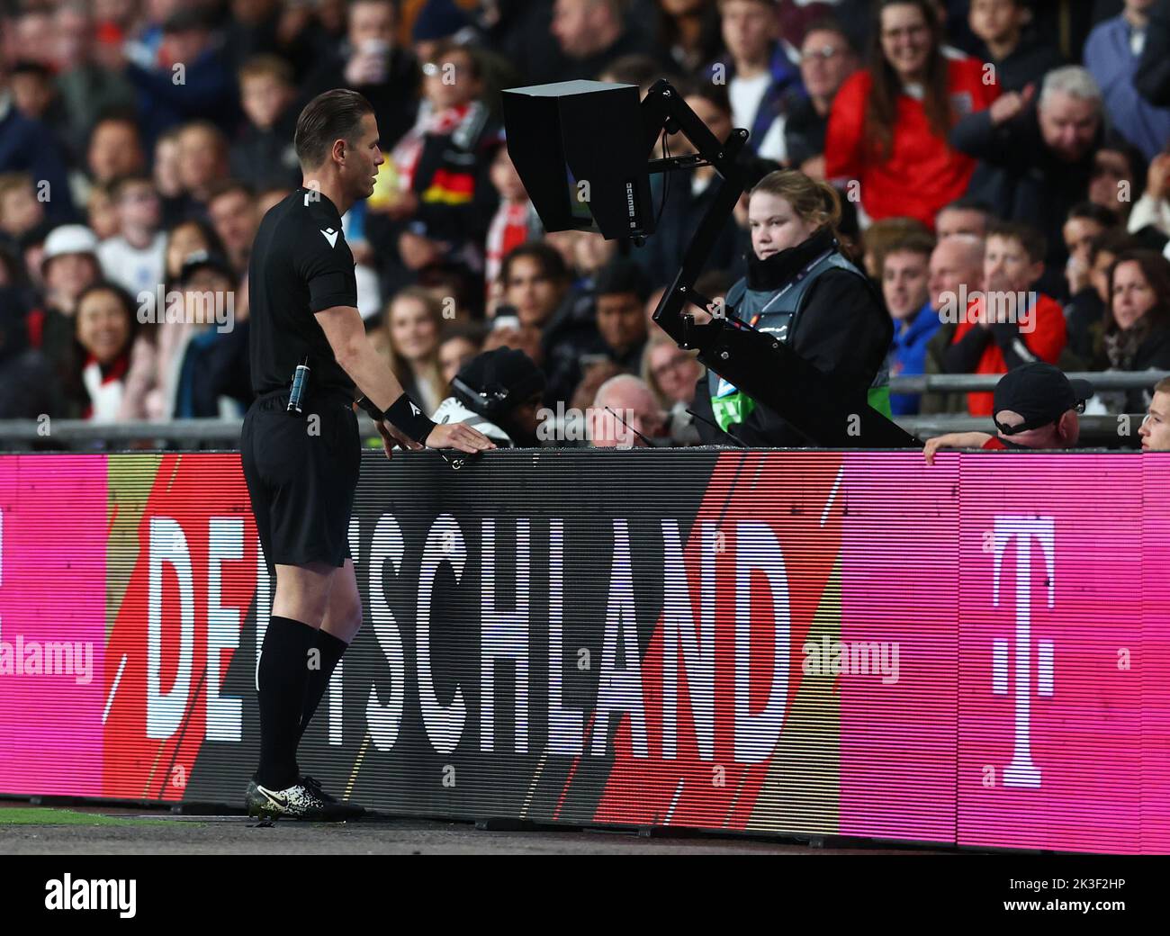 London, England, 26th September 2022. Referee Danny Makkelle checks the ...