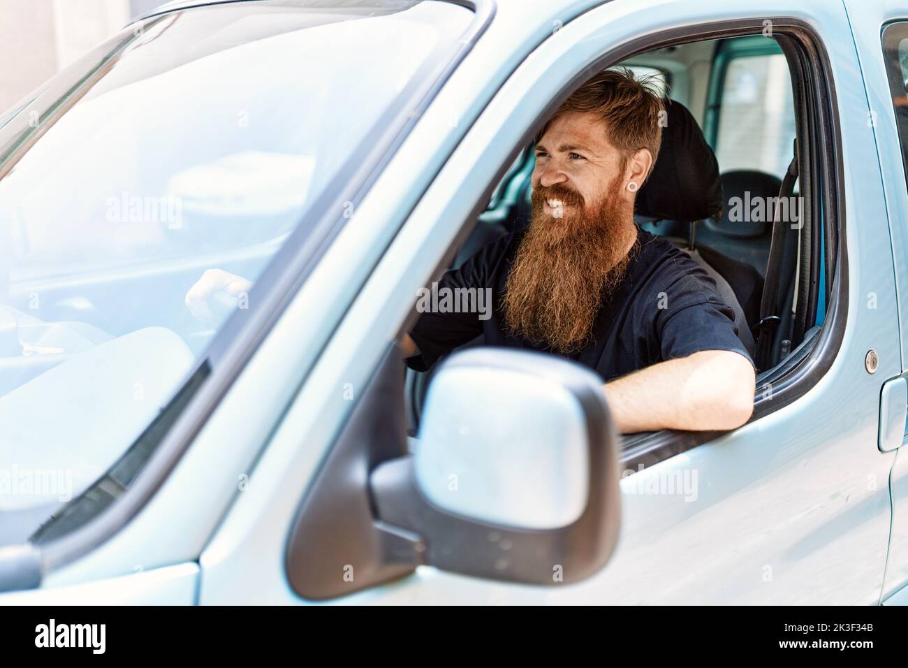 Young irish man smiling happy driving car at the city Stock Photo - Alamy