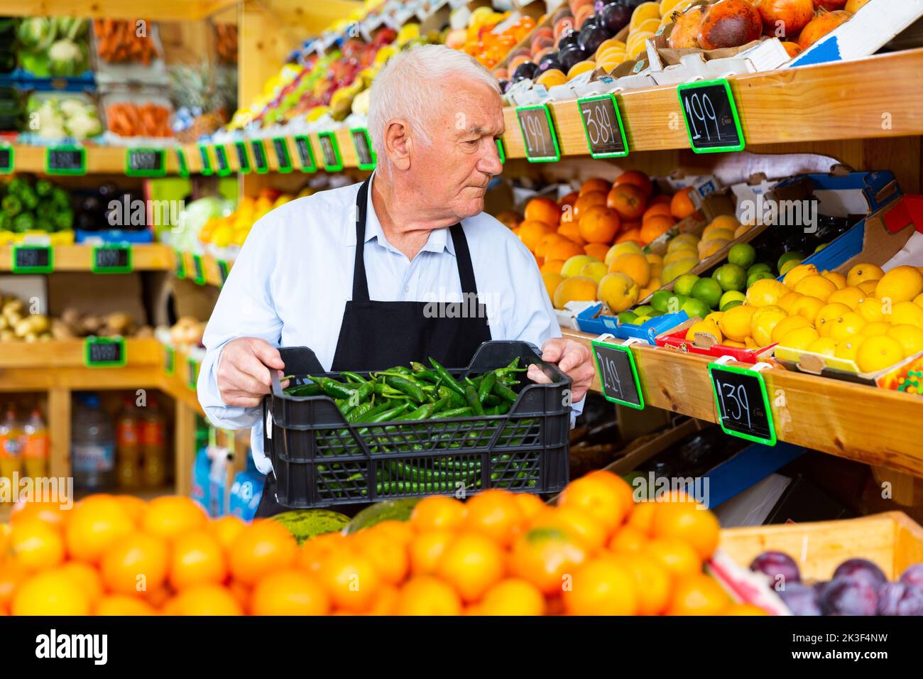 Male supermarket worker carries hi-res stock photography and images - Alamy