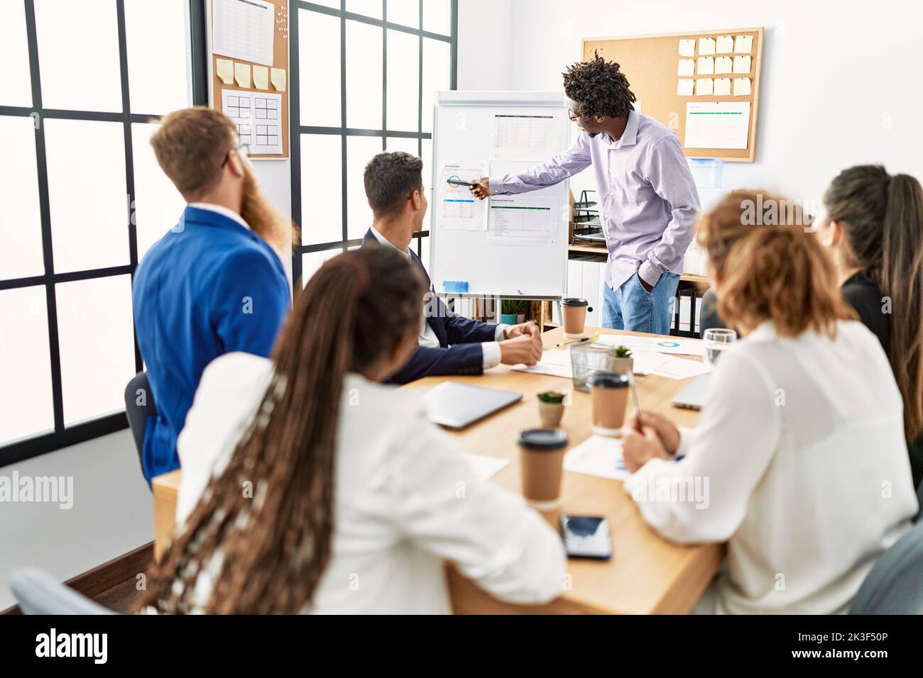 Group of business workers listening african american boss man ...