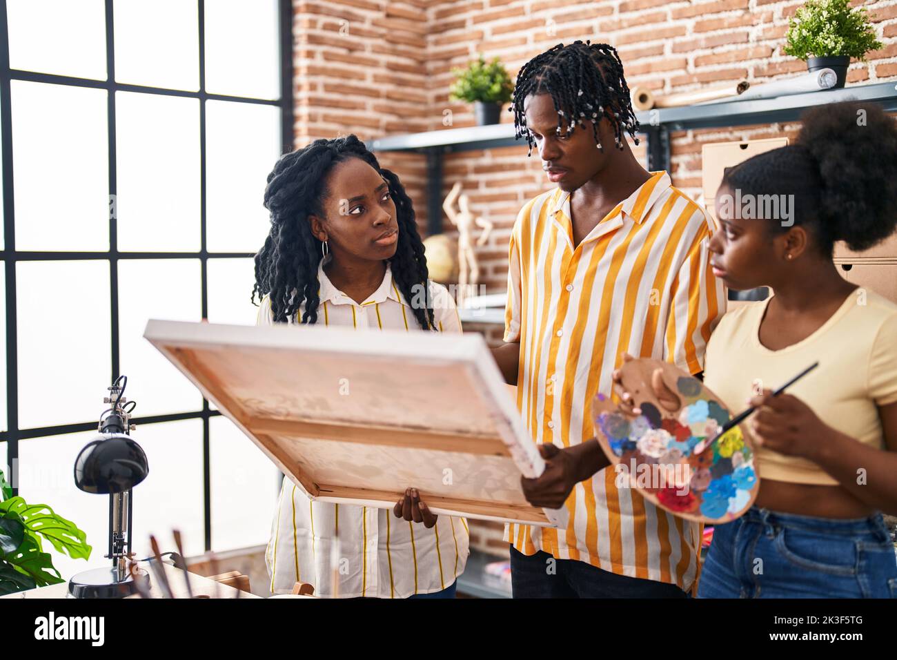 African american friends artists looking draw with doubt expression at ...