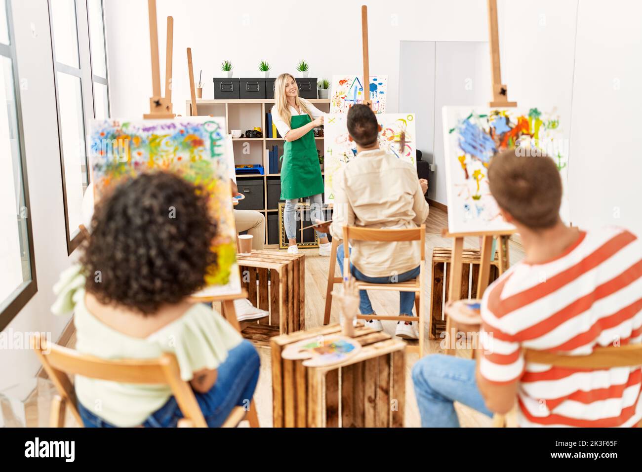 Group of people having paint class at art studio Stock Photo - Alamy