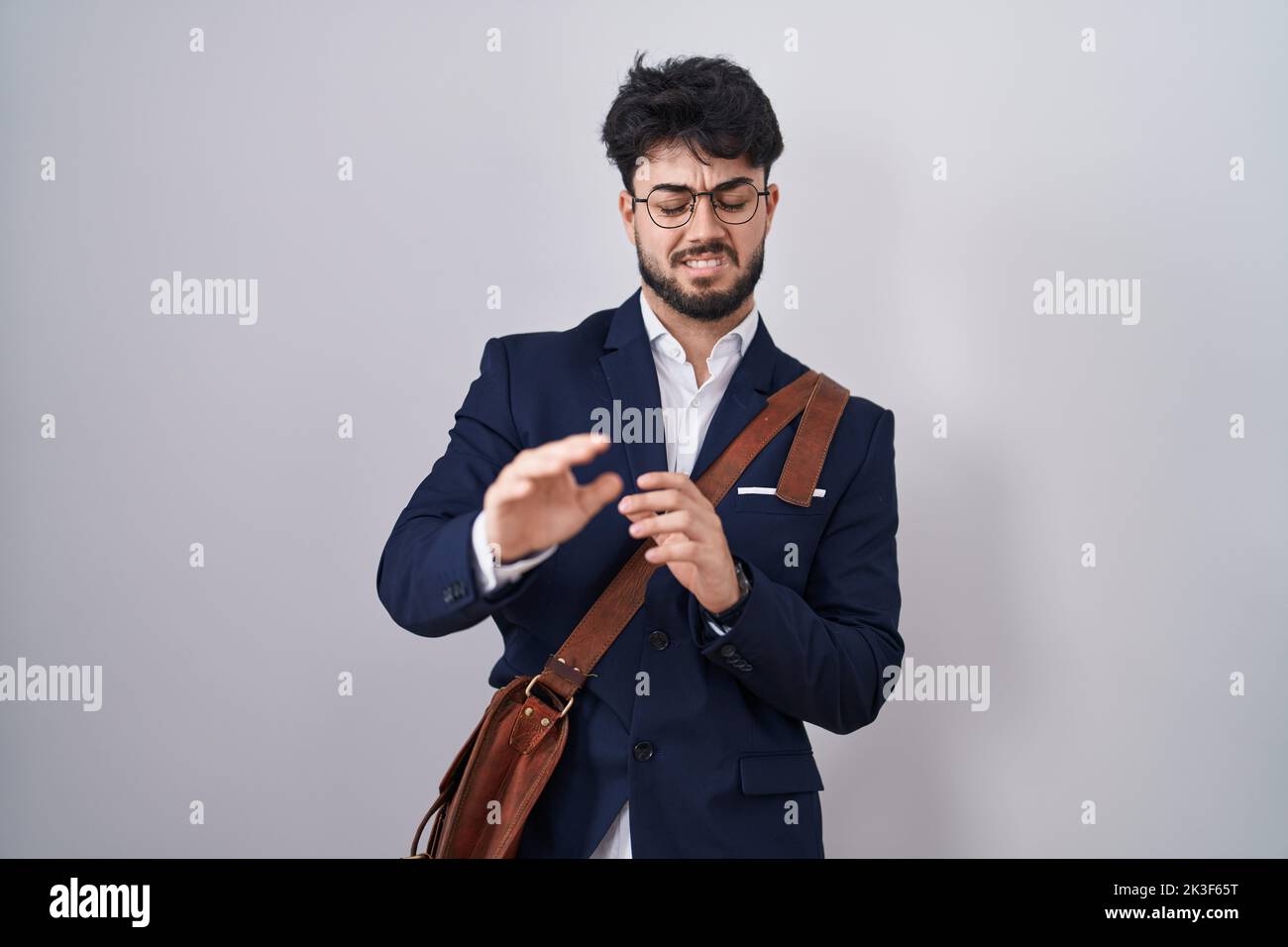 Hispanic man with beard wearing business clothes disgusted expression ...