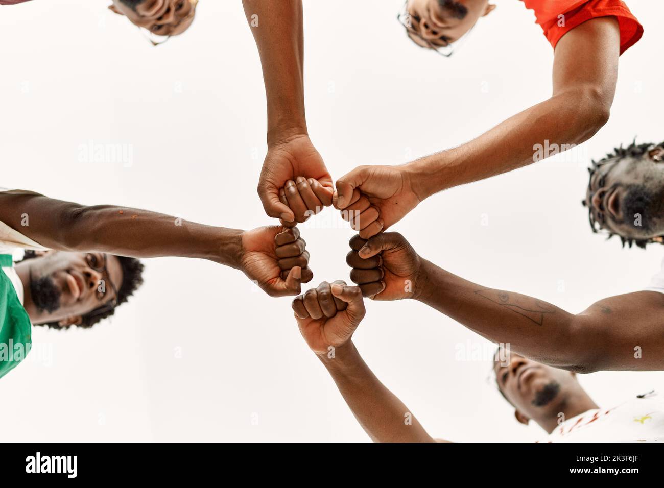 Group of young african american artist man smiling happy bump fists at ...