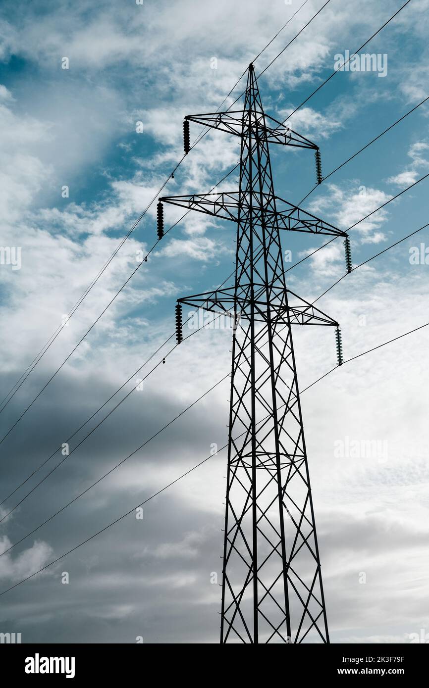 High-voltage power line with clouds. High voltage electric transmission ...