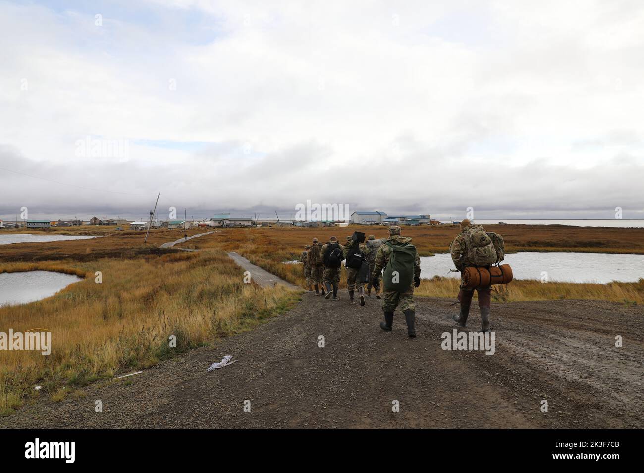 U.S. soldiers with the Alaska National Guard make their way to a tiny ...