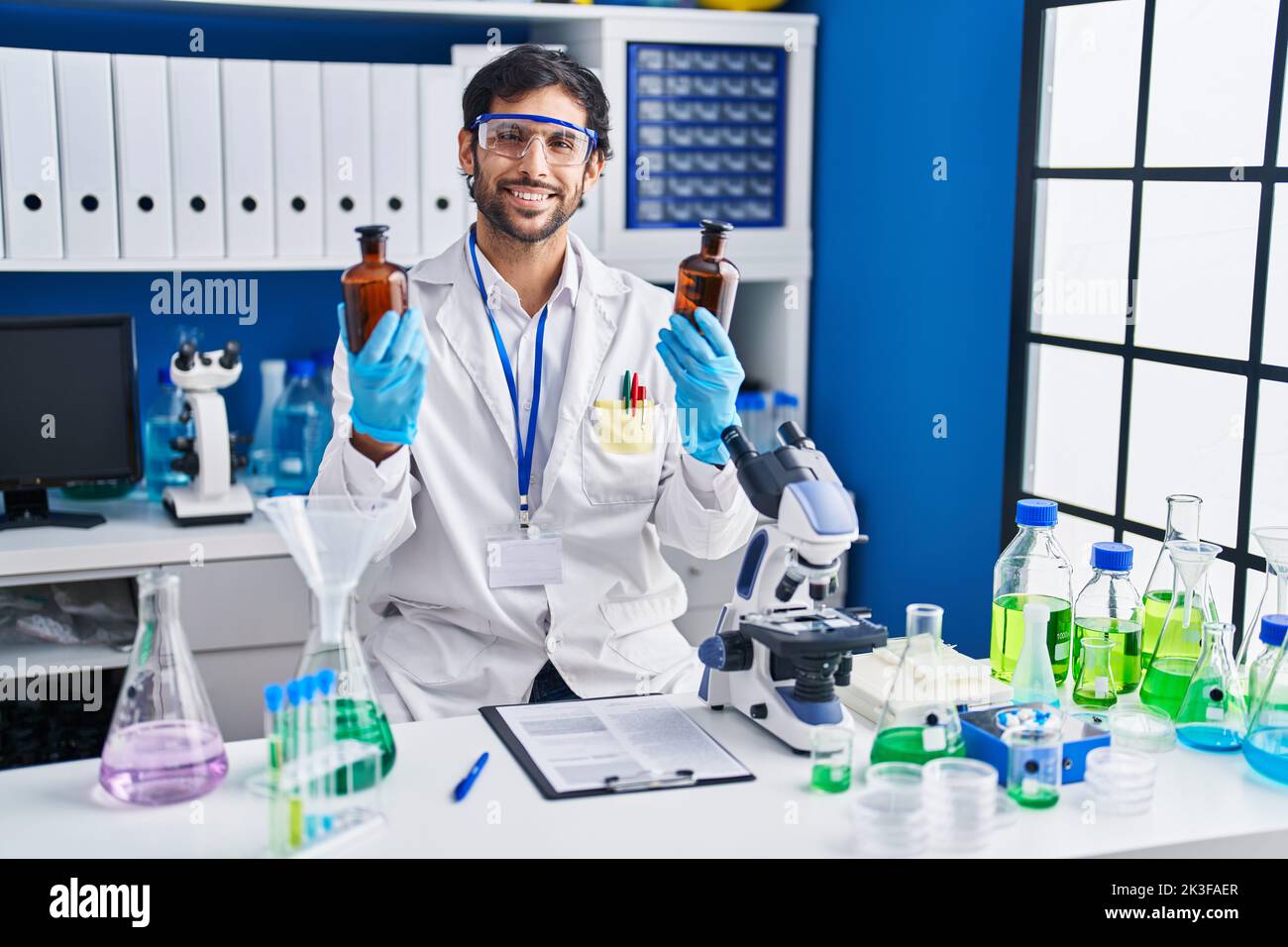 Smiling indian male scientist hi-res stock photography and images - Alamy