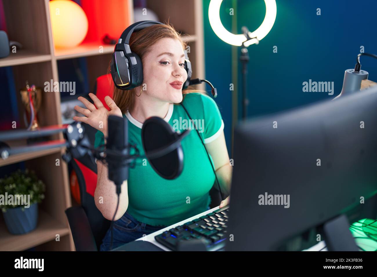 Young redhead woman streamer smiling confident having video call at ...