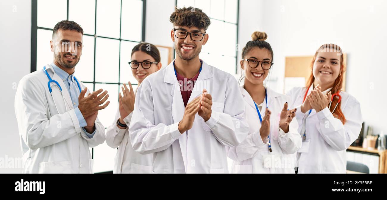 Nurse looking at camera clapping and smiling hi-res stock photography ...