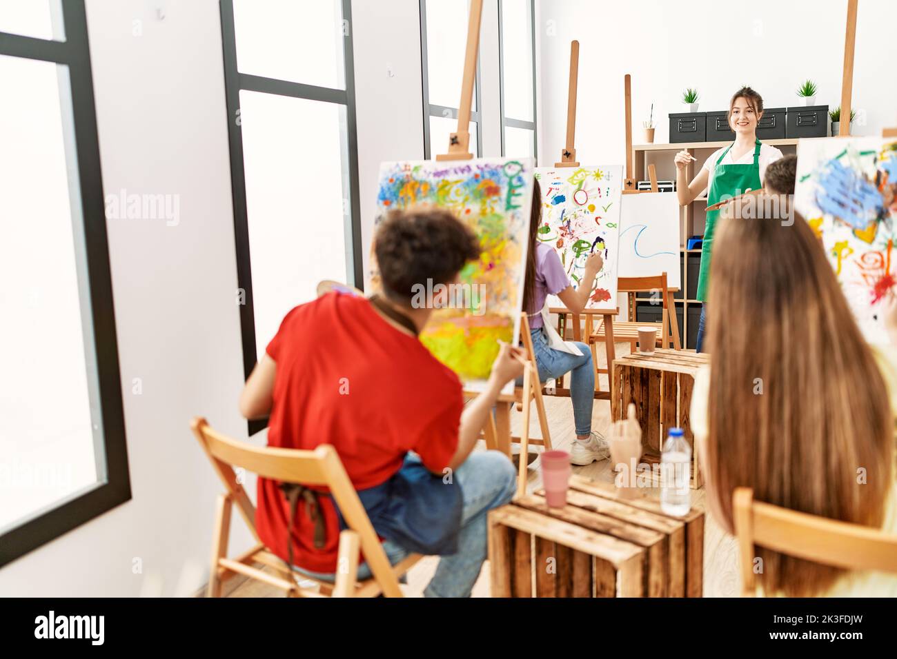 Group of people smiling happy having paint class at art studio Stock ...