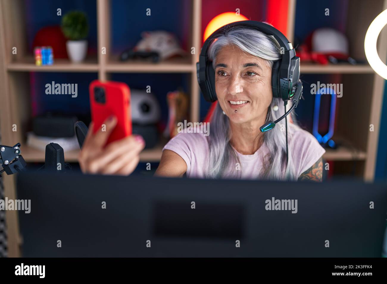 Middle age grey-haired woman streamer smiling confident make selfie by ...