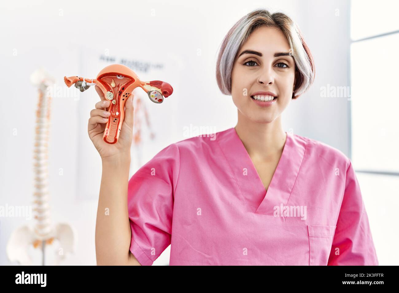 Young caucasian gynecologist woman holding fallopian tube anatomical ...