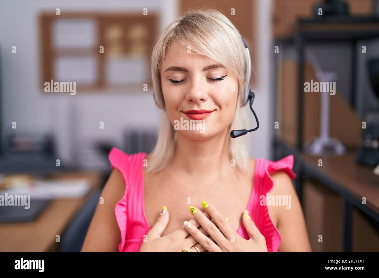 Young caucasian woman wearing call center agent headset smiling with ...