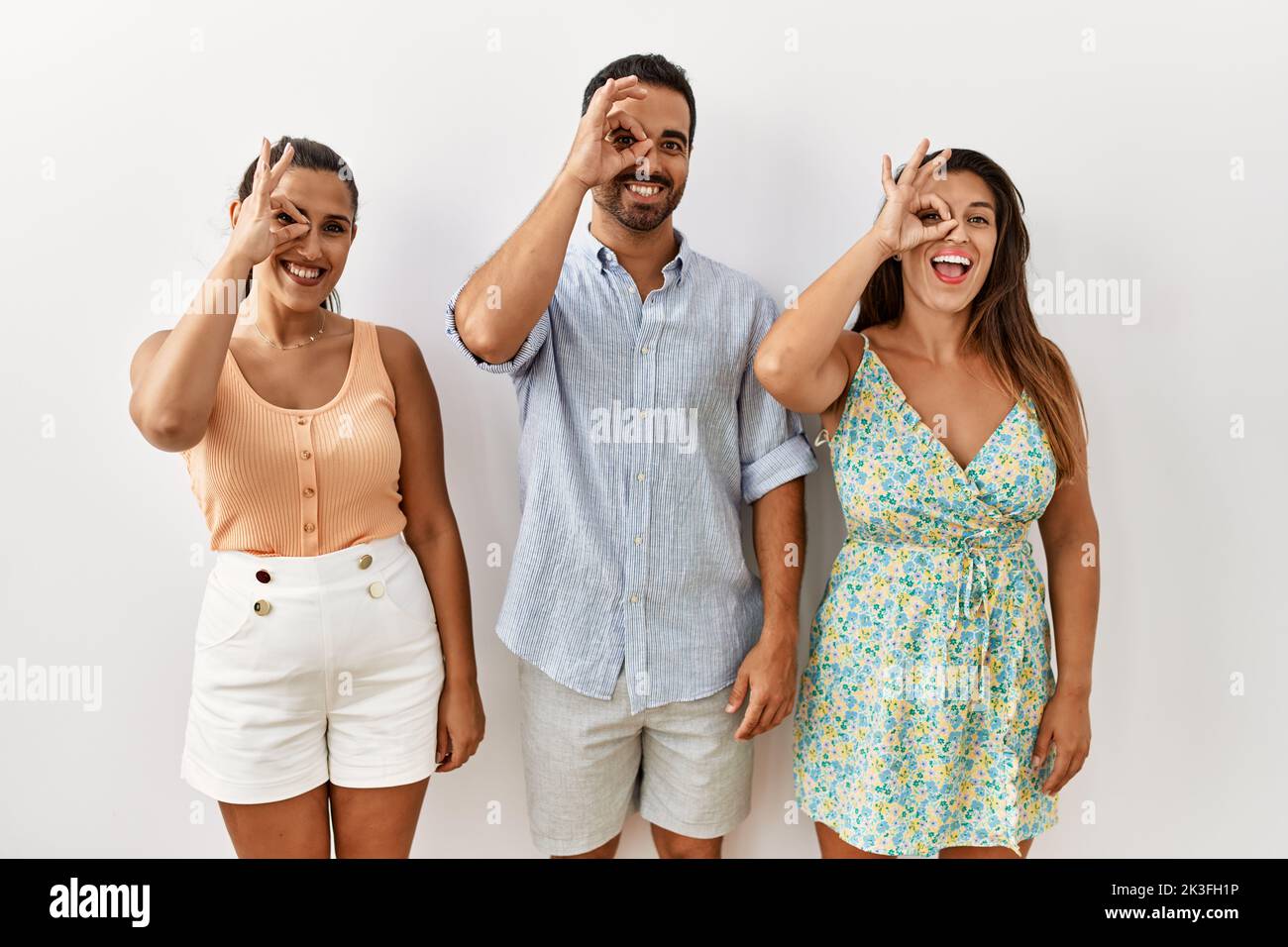 Group of young hispanic people standing over isolated background ...