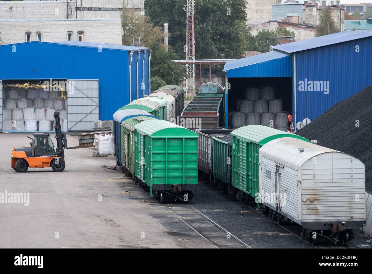 Shipping containers transporting coal by train and loader for ...