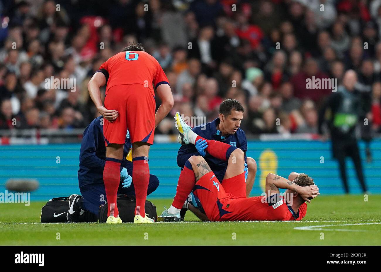 England's John Stones receives treatment for an injury during the UEFA ...