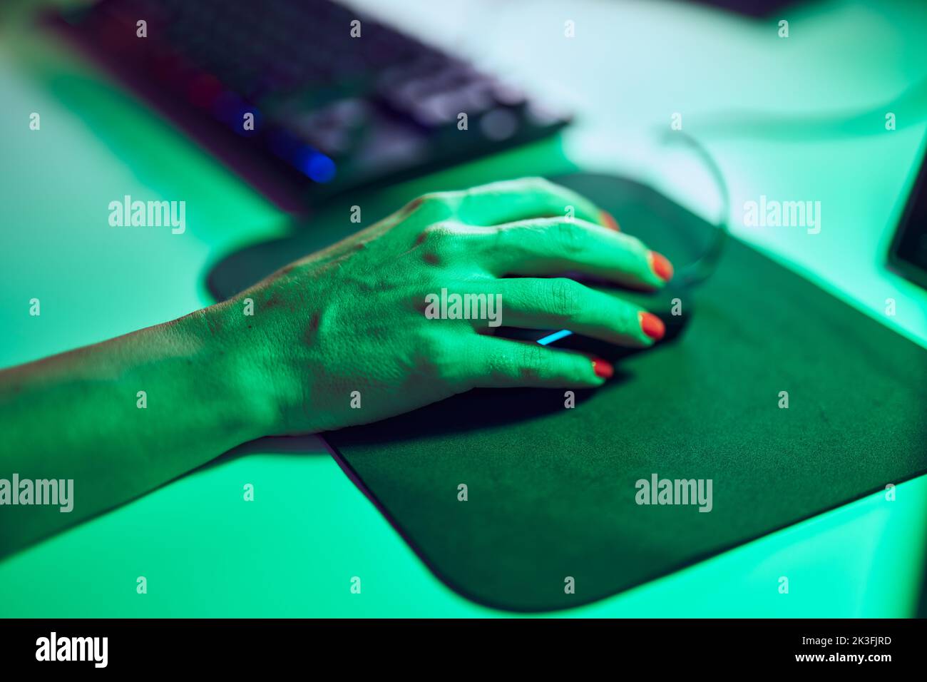 Young blonde woman streamer using mouse computer at gaming room Stock ...