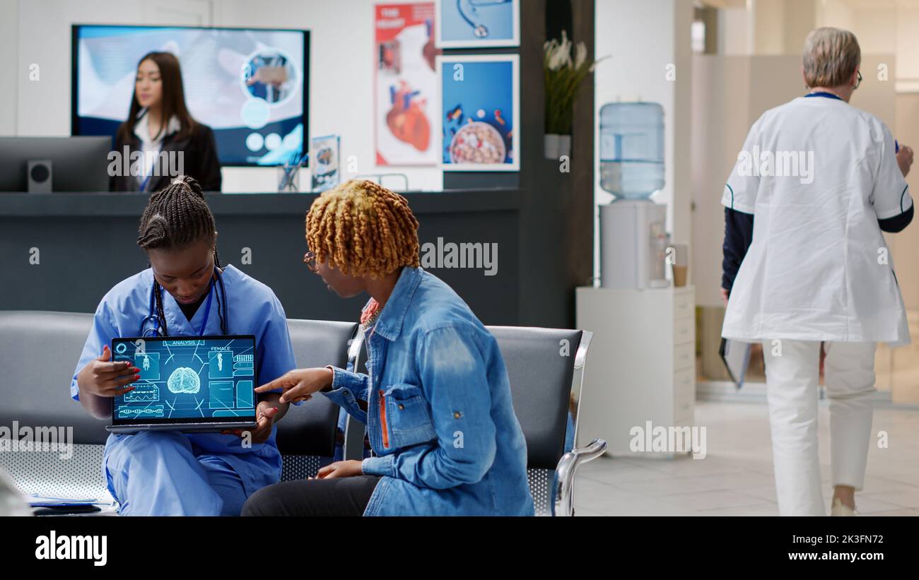 Nurse showing brain tomography man hi-res stock photography and images ...