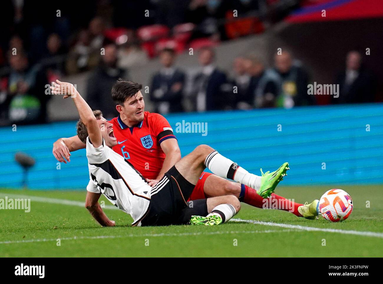 England's Harry Maguire (right) and Germany's Thomas Muller battle for ...