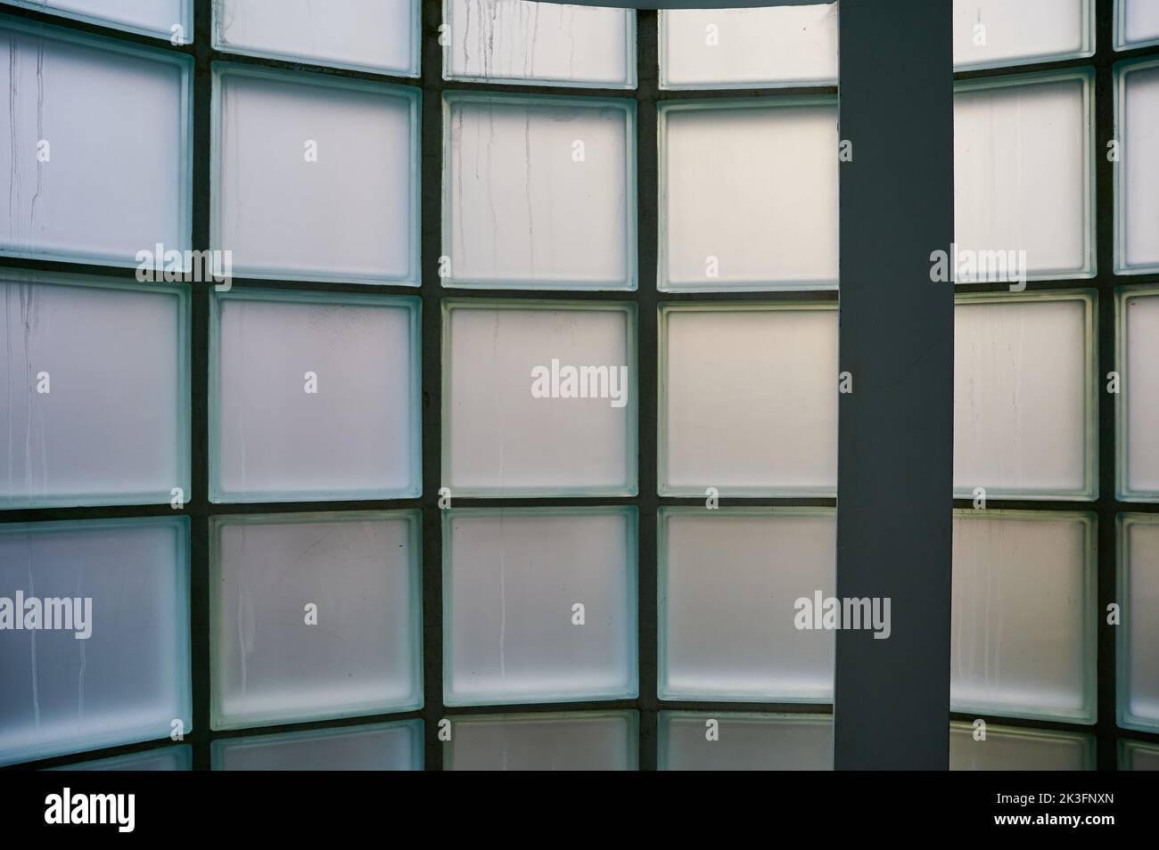 Interior of building looking at opaque of curved window constructed ...