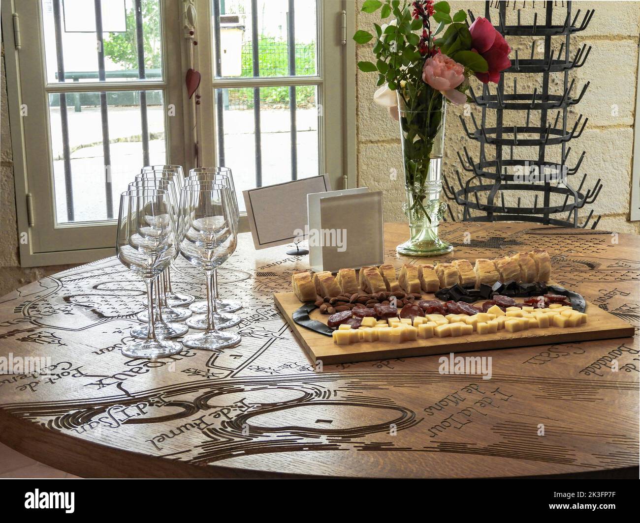 Beautiful carved wooden table set out for food and wine matching ...