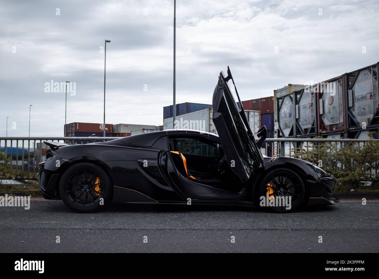The Side Of A Black 2019 McLaren 600LT Spider Supercar With Drivers ...