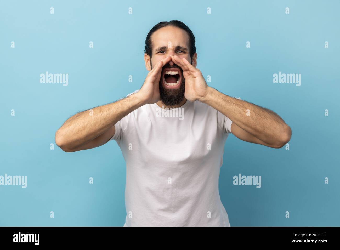 Attention, announcement. Portrait of handsome man with beard wearing ...