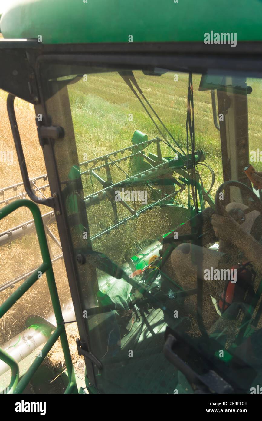 Vertical shot of the operator's cab in modern combine harvester ...