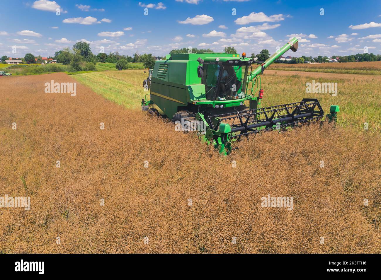 Red and green combine harvester hi-res stock photography and images - Alamy
