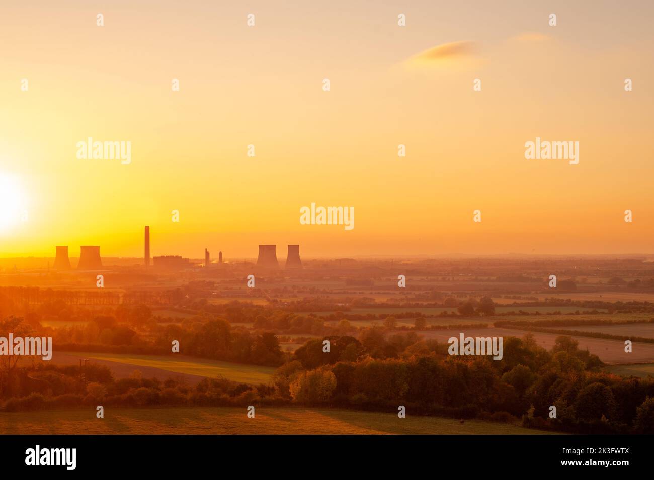 Sunset on Wittenham Clumps,with the old Didcot power station in the ...