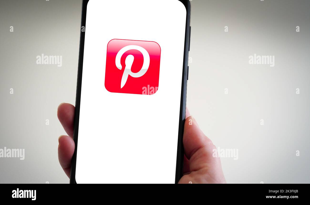 Exeter, UK - September 2022: Woman holds smartphone with Pinterest ...