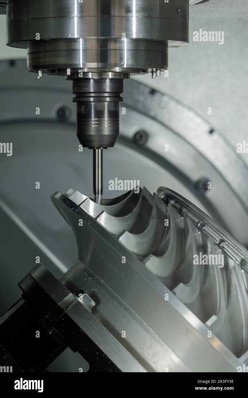 Automated cnc turning milling machine cutting metal workpiece at ...