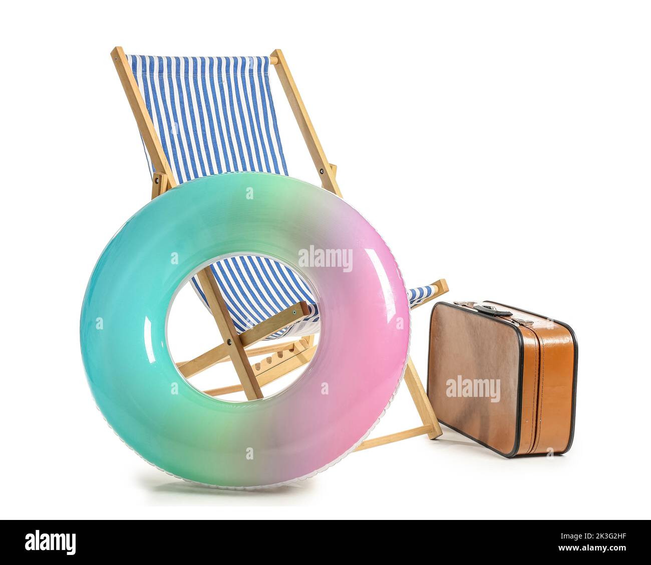 Beach deck chair, inflatable ring and suitcase on white background ...