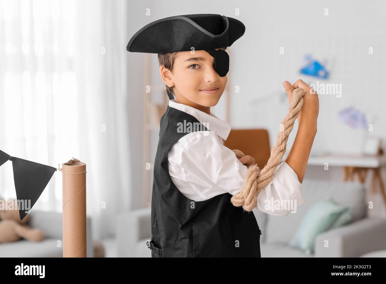 Little boy dressed as pirate playing with rope at home Stock Photo - Alamy