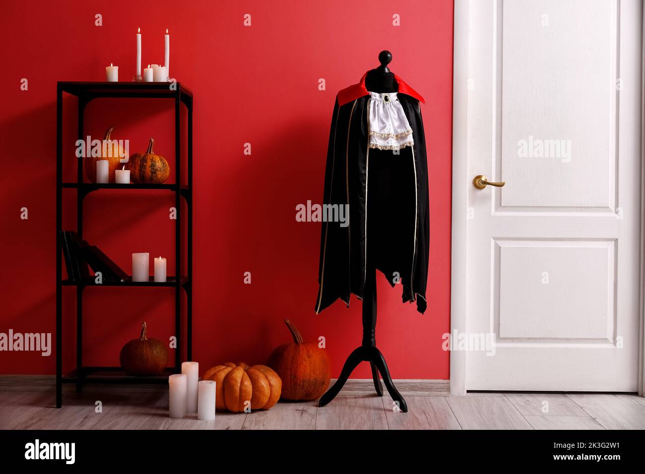 Interior of hall with shelving unit, vampire costume and Halloween ...
