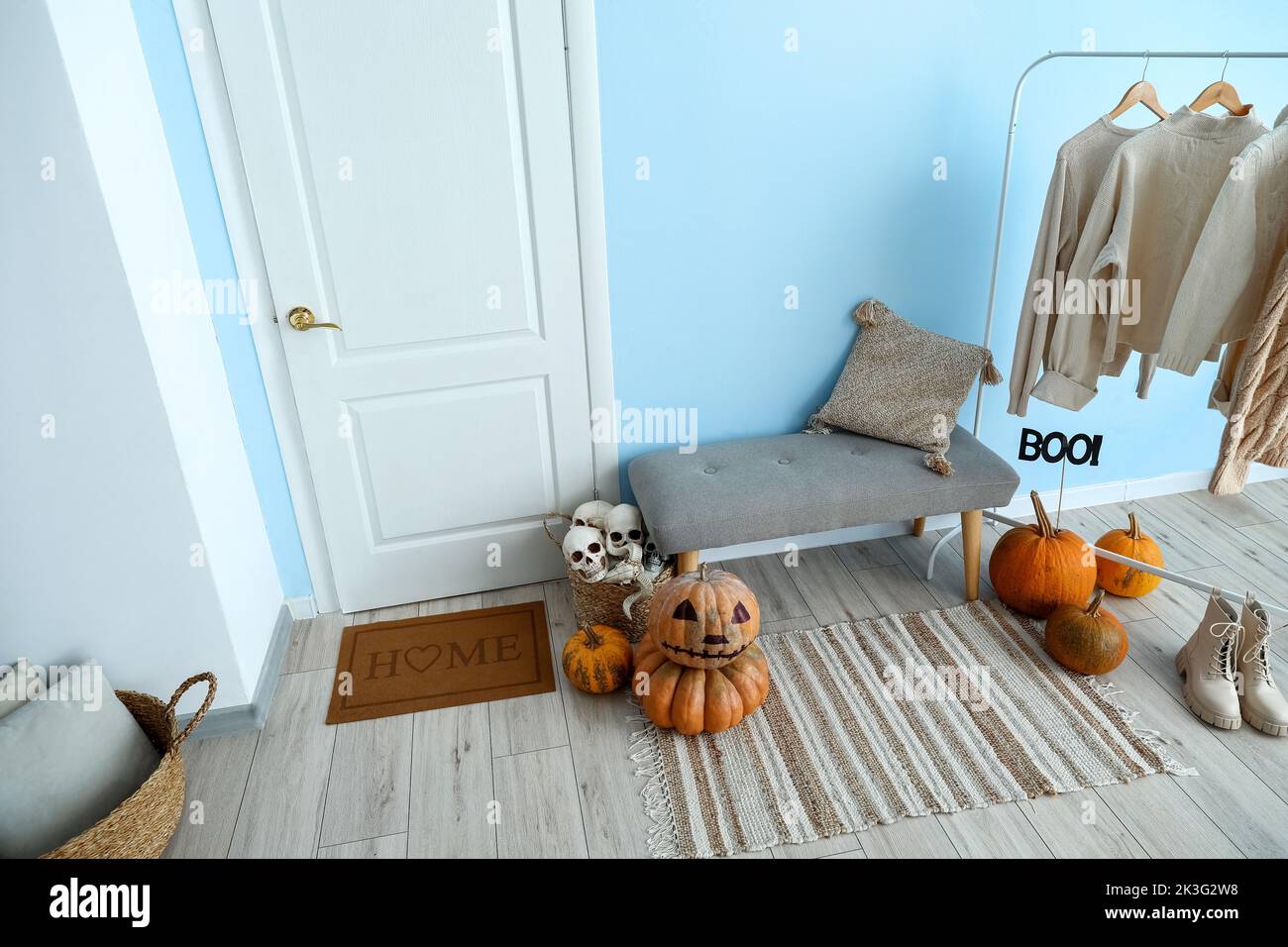 Interior of hall with bench, clothes and Halloween decor Stock Photo ...