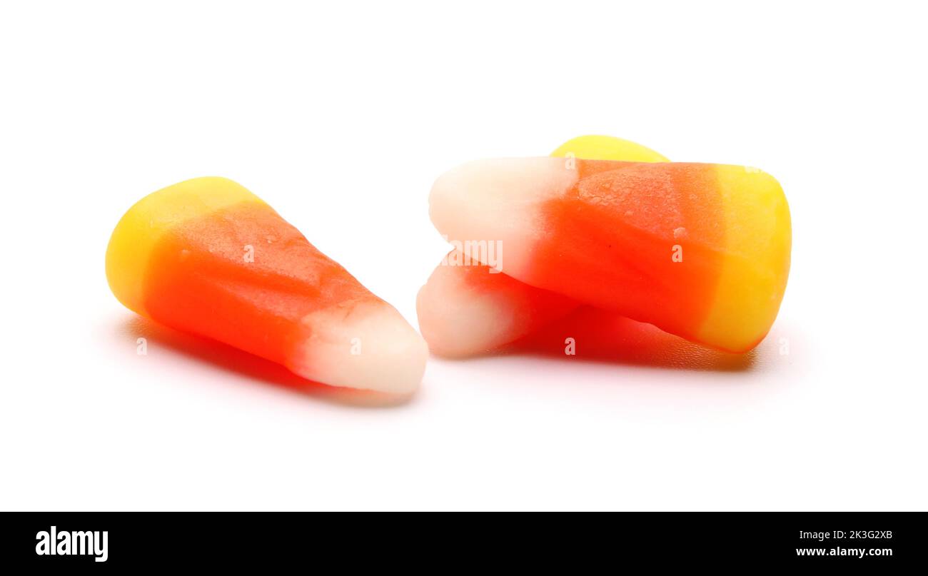 Halloween candy corns on white background Stock Photo - Alamy