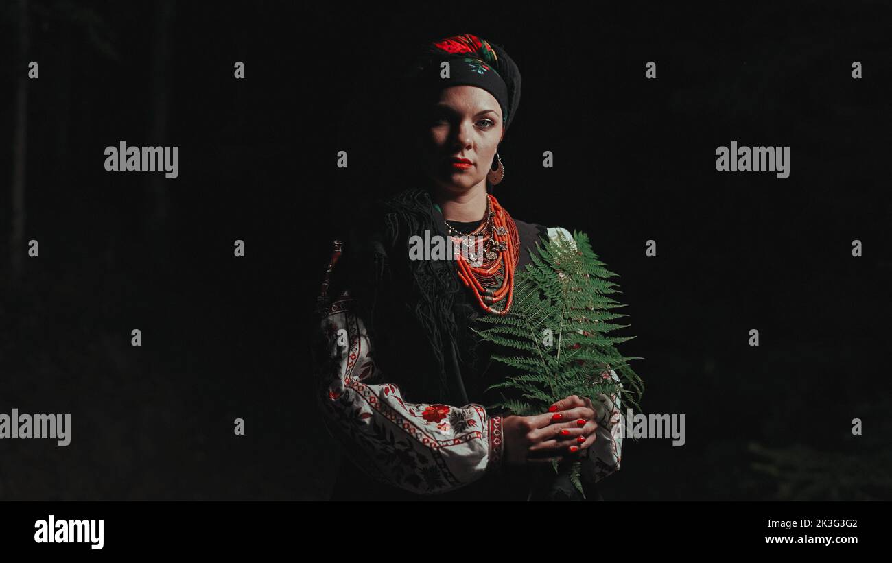 Authentic woman in traditional ukrainian handkerchief, necklace and ...