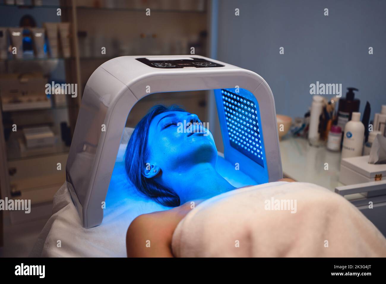 A Young Woman Takes Care Of Her Skin With An Led Mask In A Beauty Salon