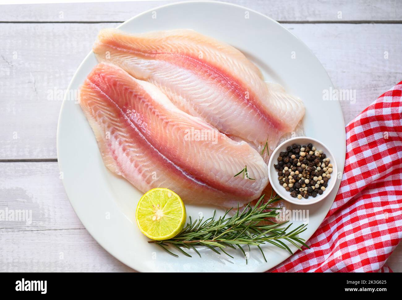 fresh raw pangasius fish fillet with herb and spices lemon lime and ...