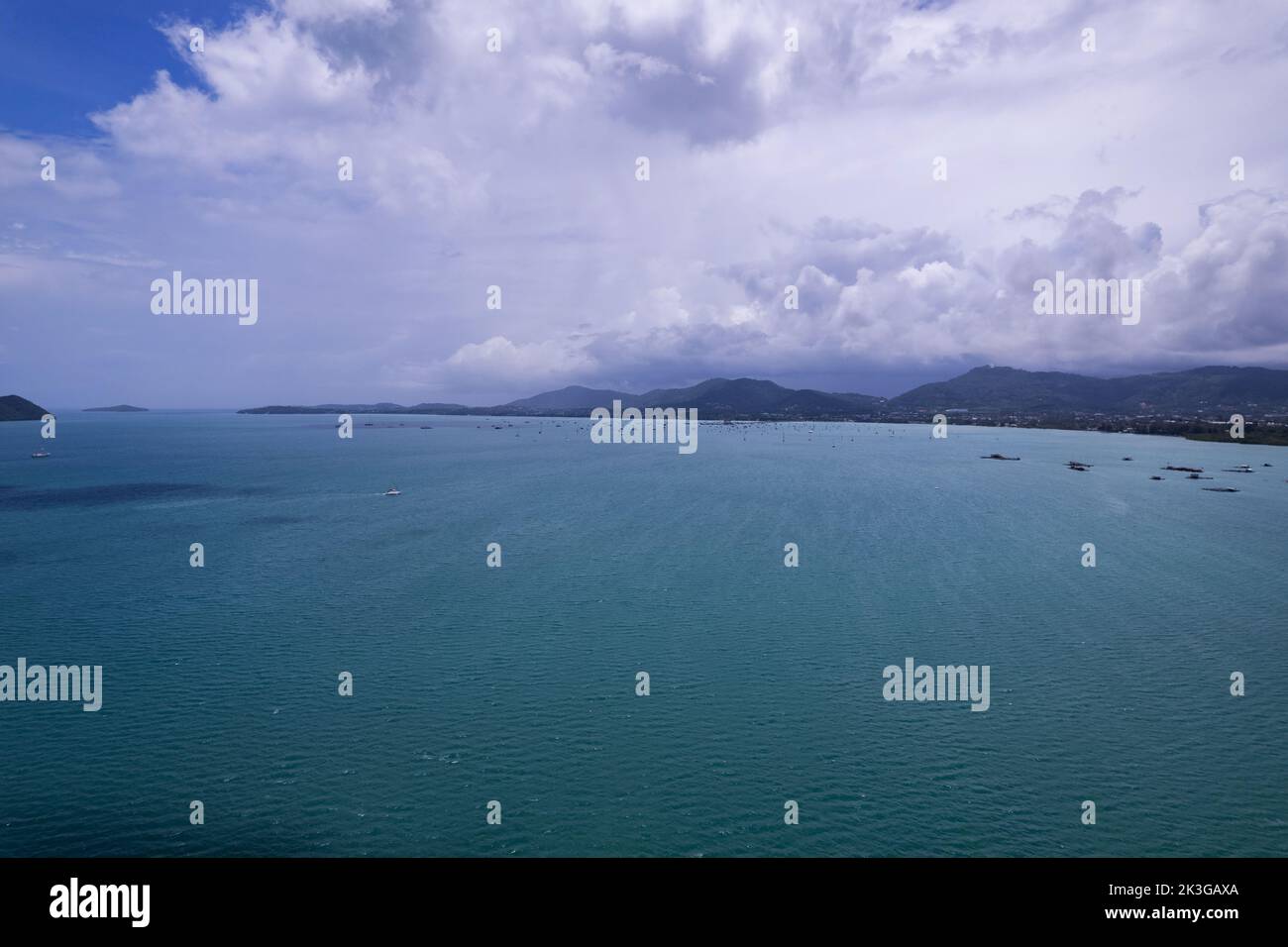 Aerial view of a blue sea surface water texture background and sun ...