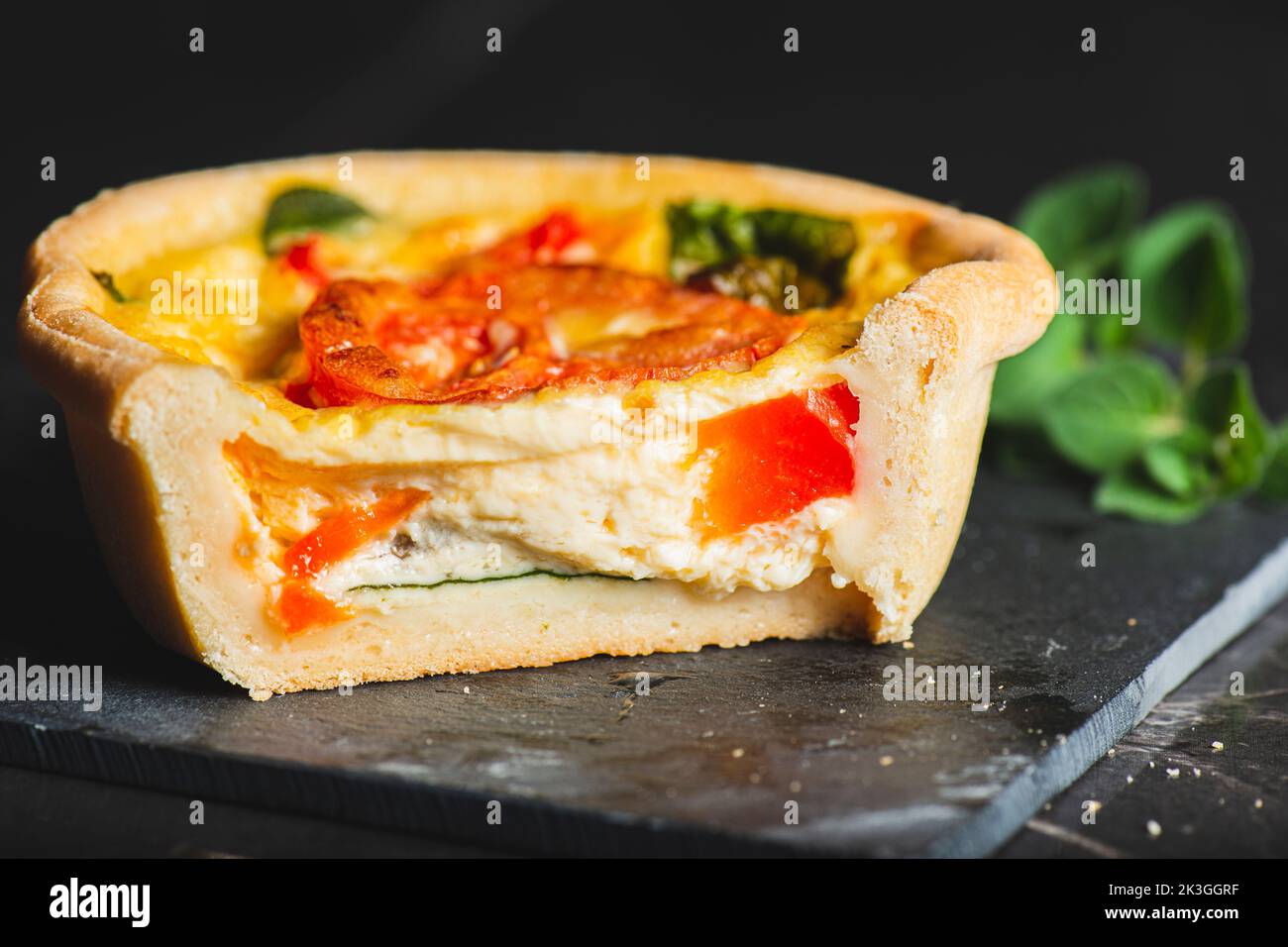Freshly made and baked Vegetarian Quiche with spinach, capsicum, egg ...