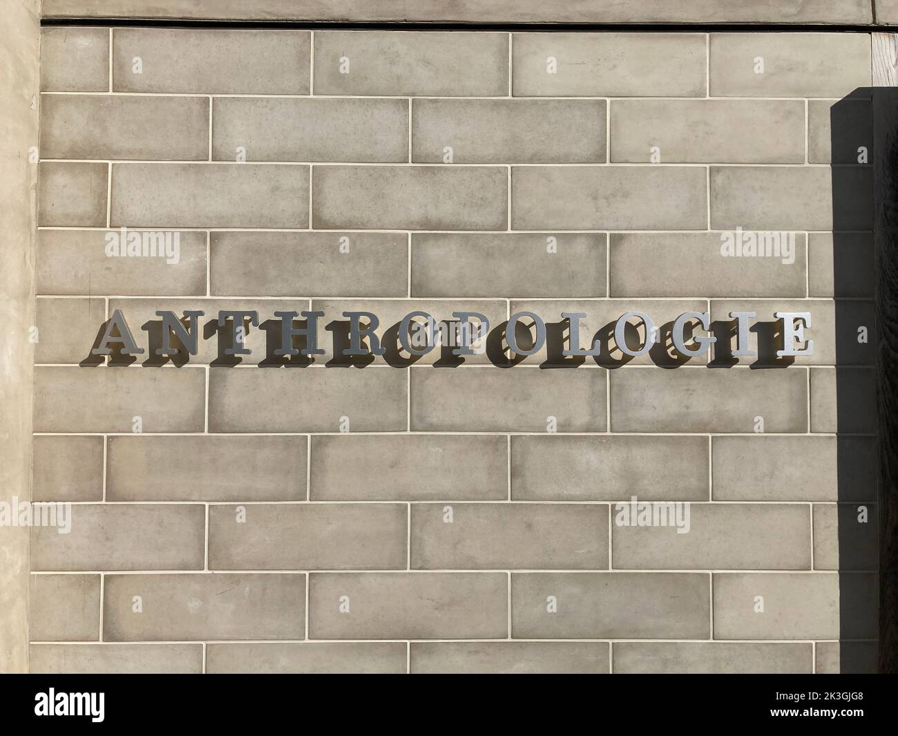 Anthropologie sign, logo of the store facade of clothing retail company ...