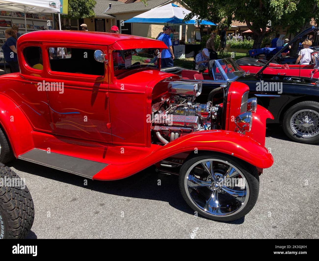 Colorful cars parked and displayed on the street during Classic and ...