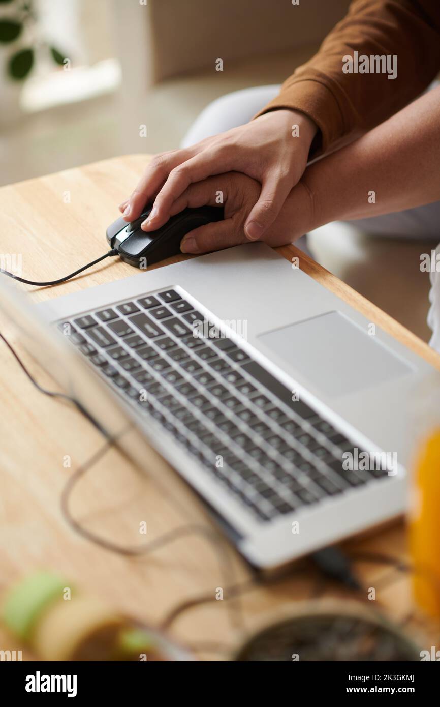 Closeup image of grandson helping grandmother to understand how to used ...