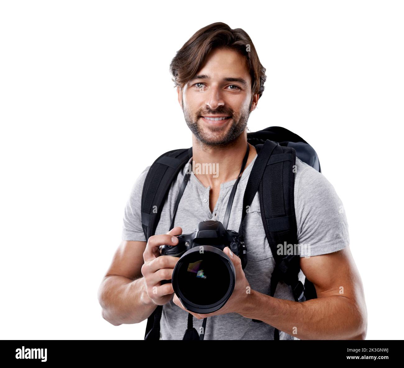 All you need is the right equipment. A handsome photographer smiling at ...