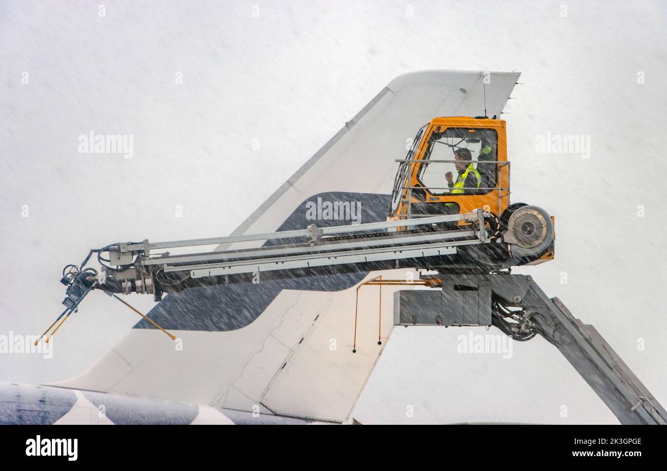 HELSINKI, FINLAND, FEB 15 2022, A aircraft de-icing (anti-icing) using ...