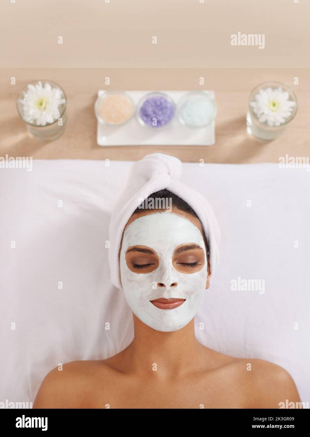 Unwinding at the beauty spa. a young woman enjoying a facial treatment ...