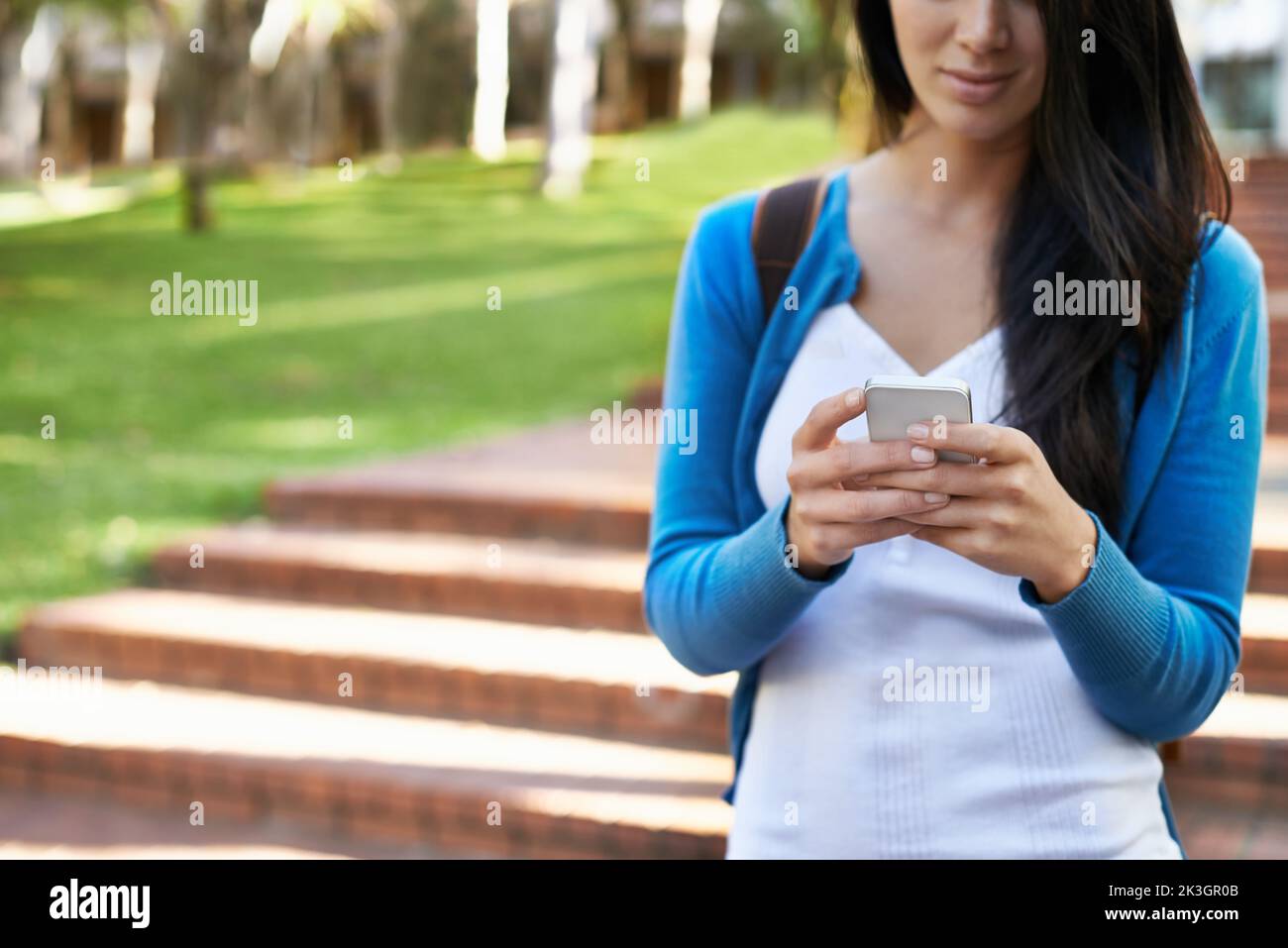 Keeping in touch while between classes...Cropped view of a college ...